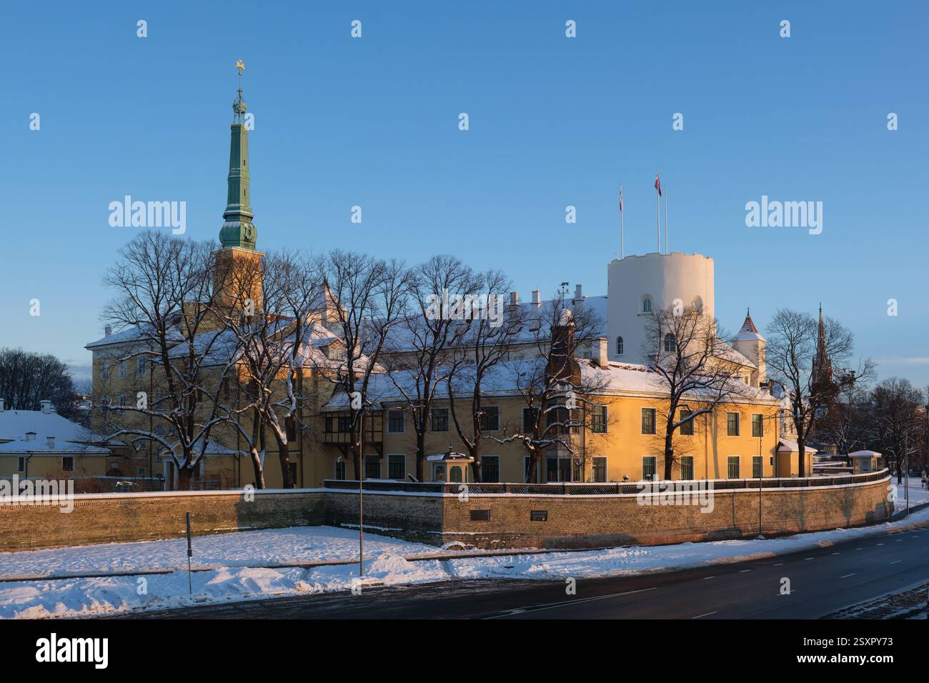 Historic Riga Castle in Latvia, covered in snow on a clear winter day ...