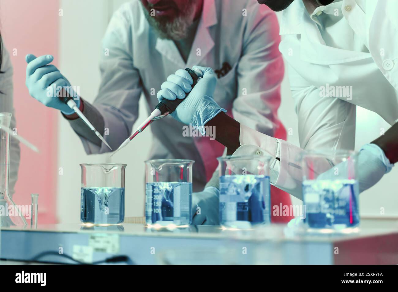 Pipetting scientists wearing lab hi-res stock photography and images ...