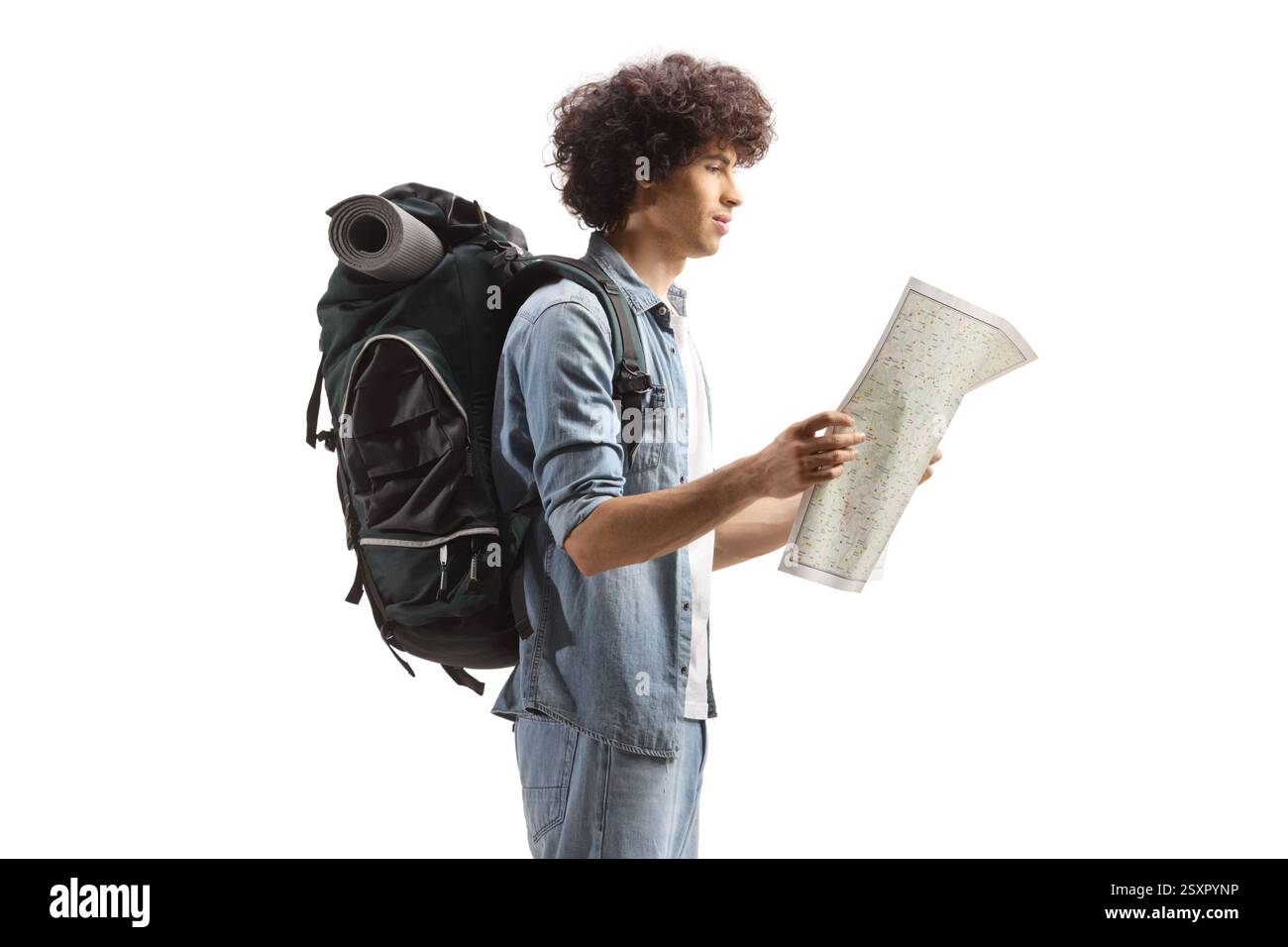 Young male traveler reading a map isolated on white background Stock ...