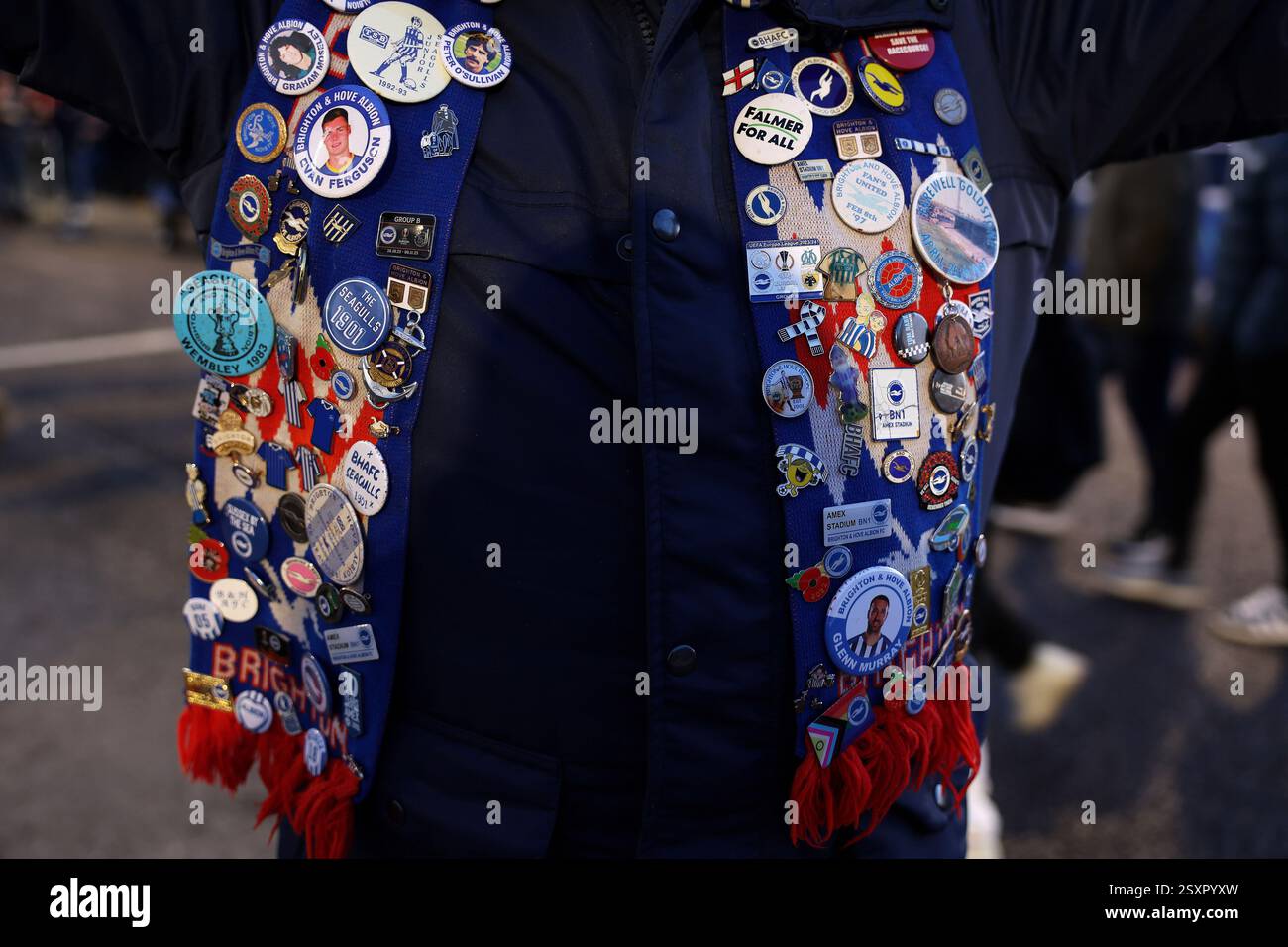 Brighton and Hove, UK. 25th Feb, 2025. A Brighton fan with a selection ...