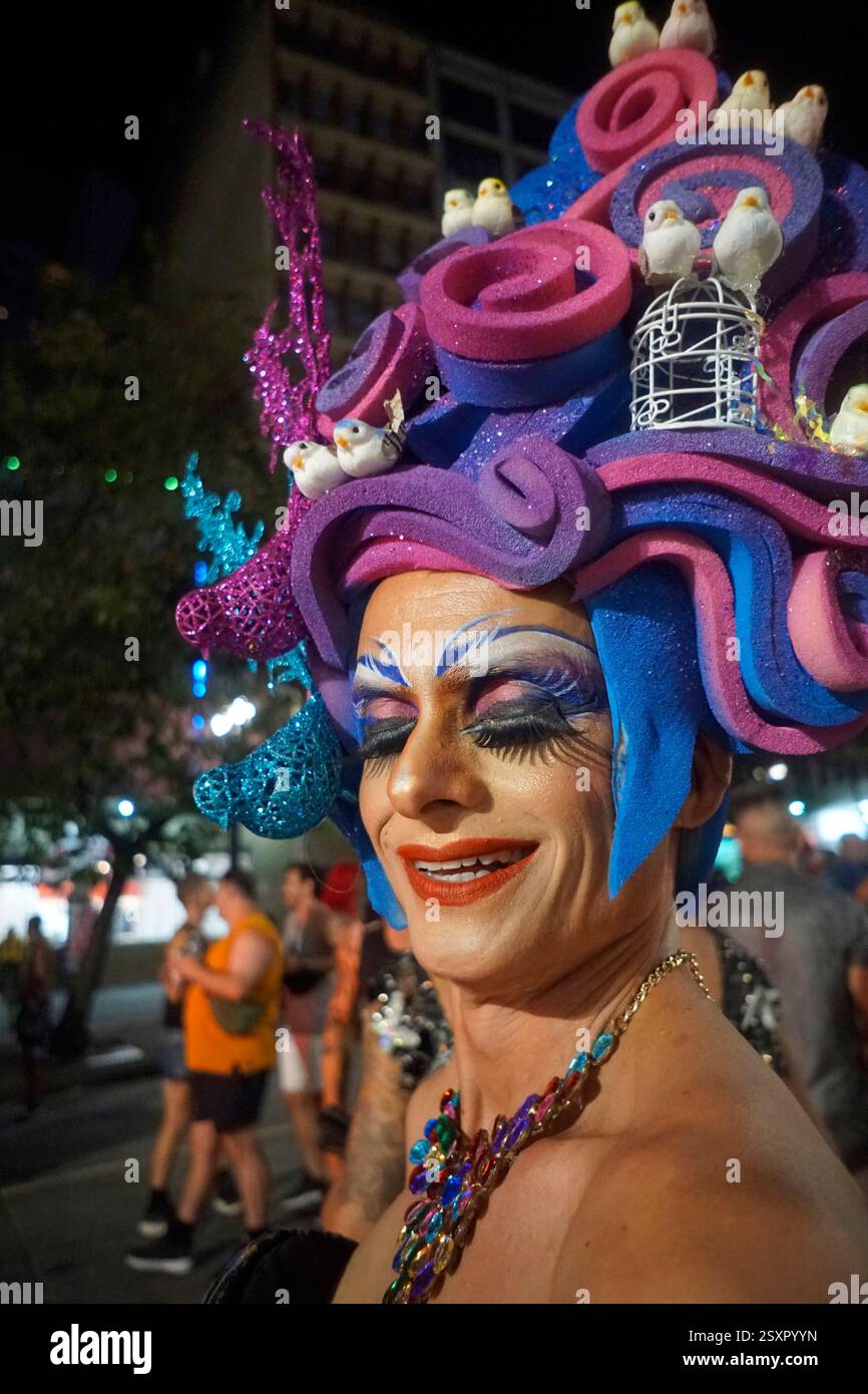 Revelers have fun at the pre-carnival street party in Sao Paulo, Brazil, on February 25, 2025 ...