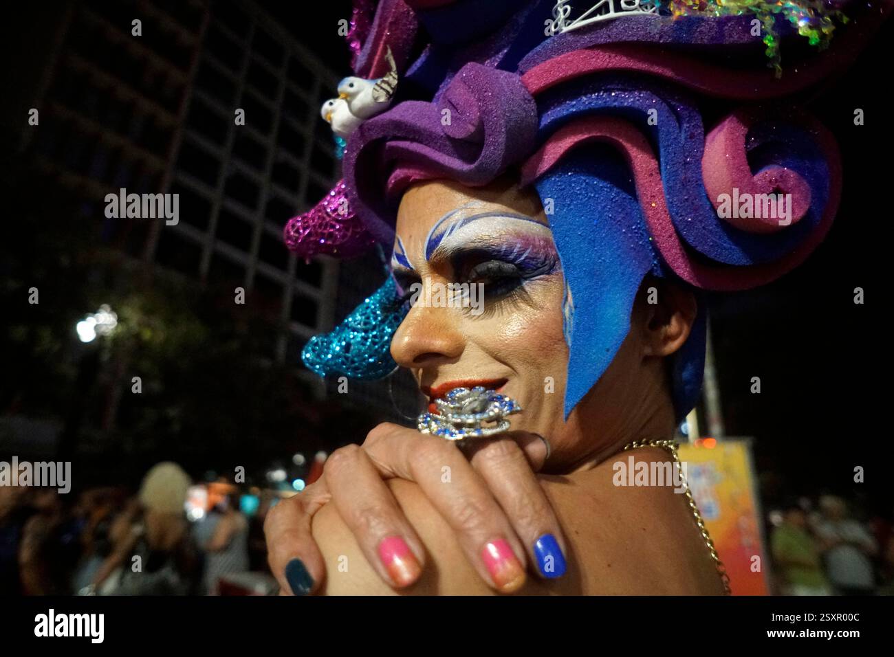 Revelers have fun at the pre-carnival street party in Sao Paulo, Brazil ...