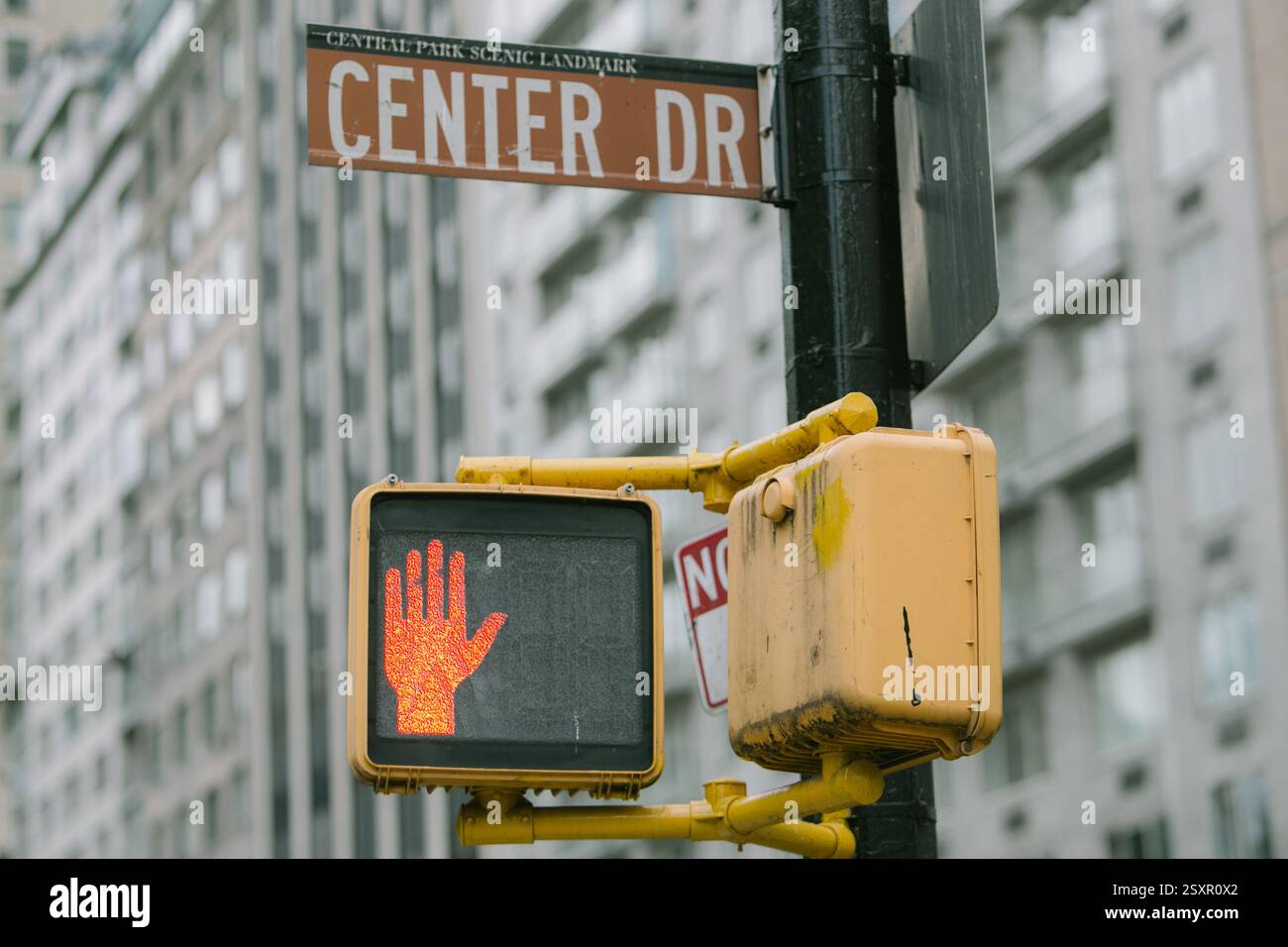 Bright stop signal showing a hand at Central Park intersection with ...