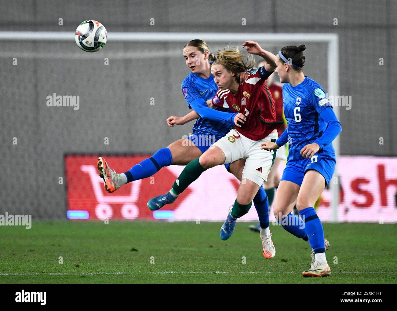 Henrietta Csiszar, center, of Hungary fights for the ball with Joanna ...