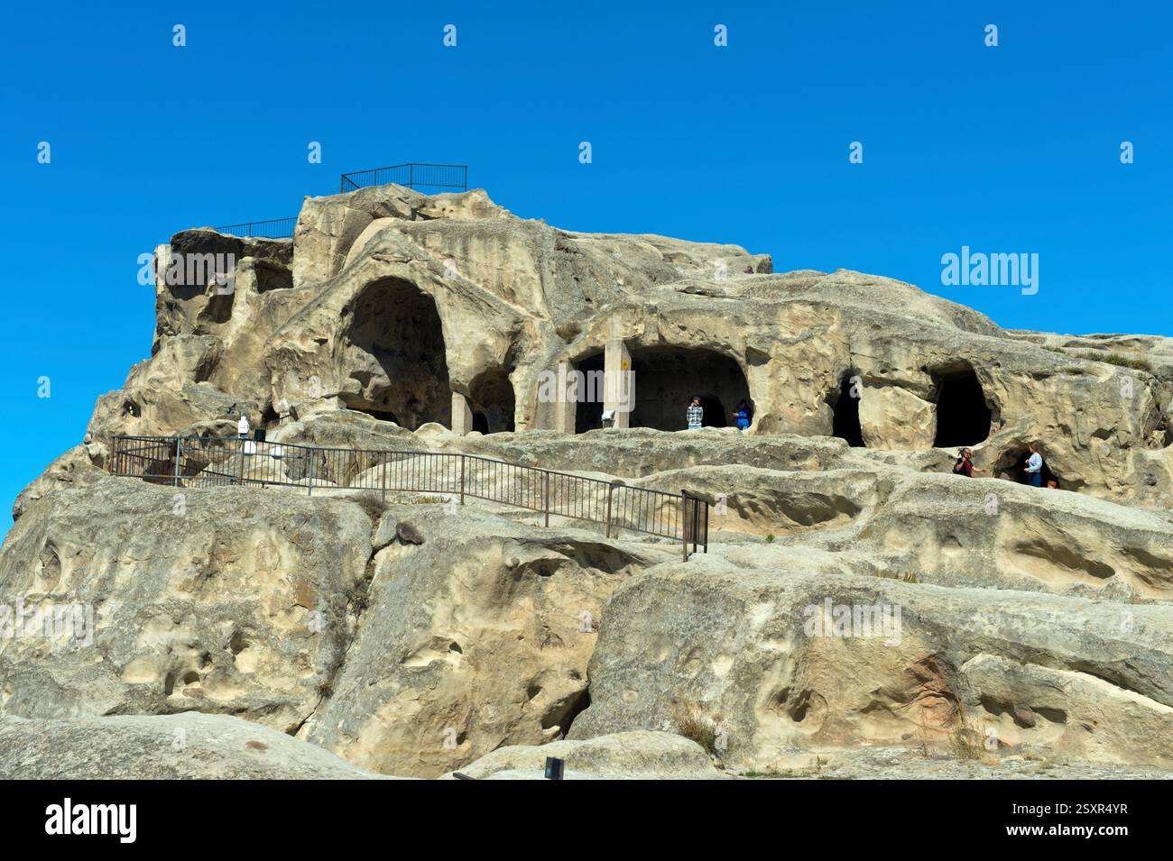 Cave buildings in the ancient rock-hewn town Uplistsikhe near Gori ...