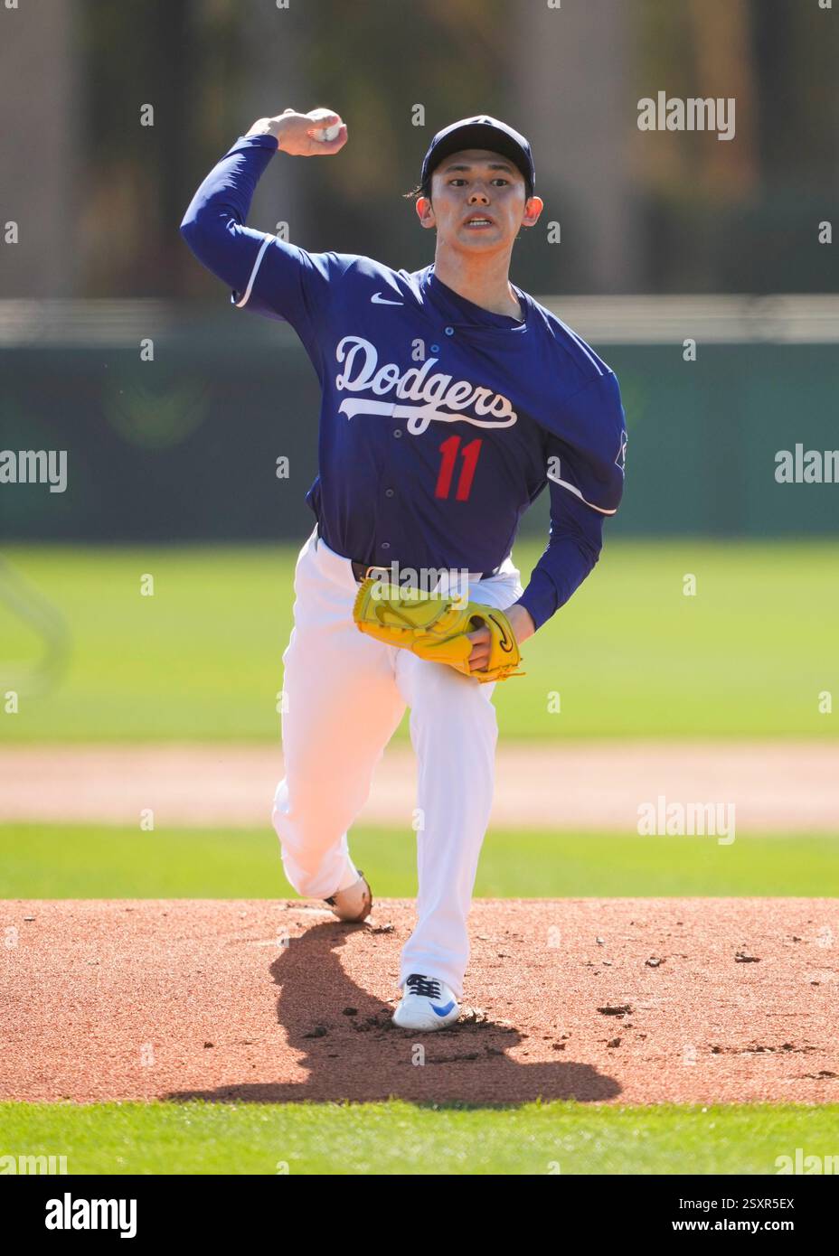 Los Angeles Dodgers pitcher Roki Sasaki throws during a spring training ...