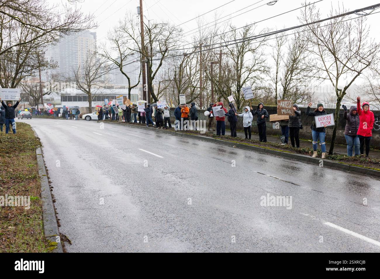 Portland, USA. 24th Feb, 2025. About 200 people braved a downpour on ...