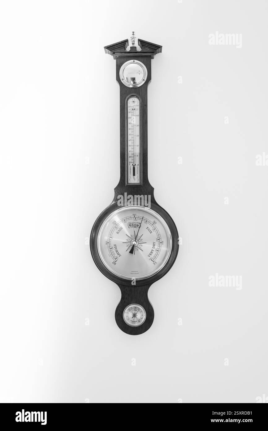 Close up of an aneroid barometer mounted on a wall Stock Photo - Alamy
