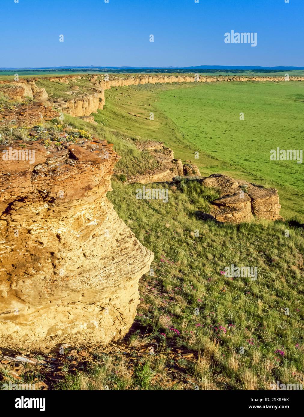sandstone outcrop known as the big wall extending across the prairie ...