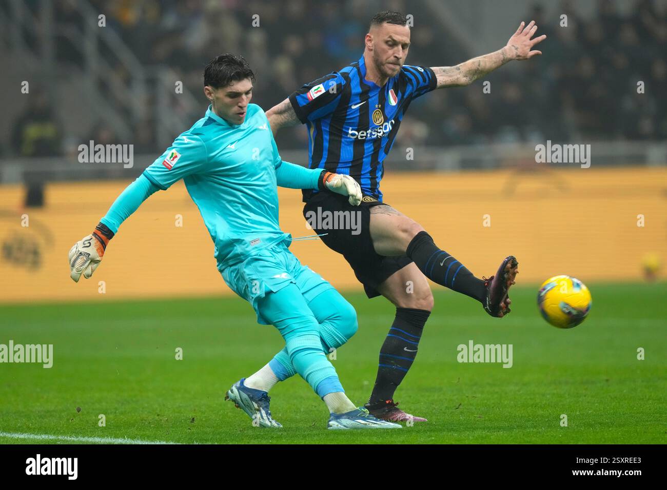 Lazio's goalkeeper Christos Mandas, left, challenges for the ball with ...