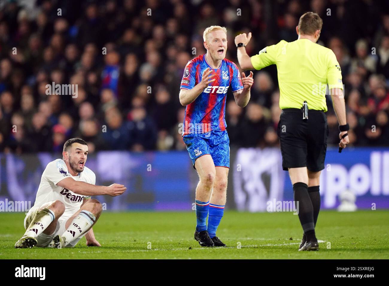 Crystal Palace's Will Hughes (centre) reacts after referee Sam Barrott ...