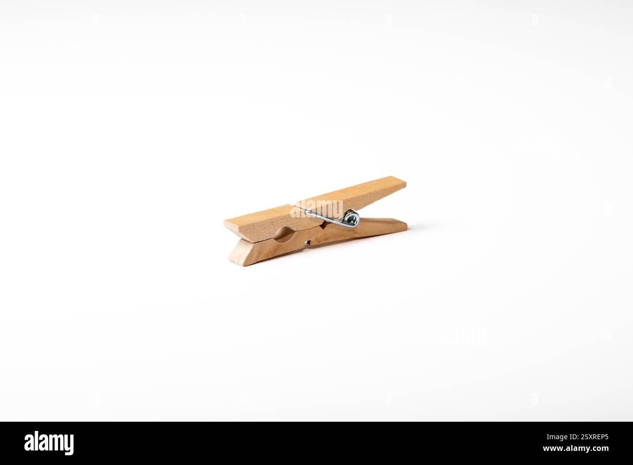 Wooden clothes peg isolated on white background Stock Photo - Alamy