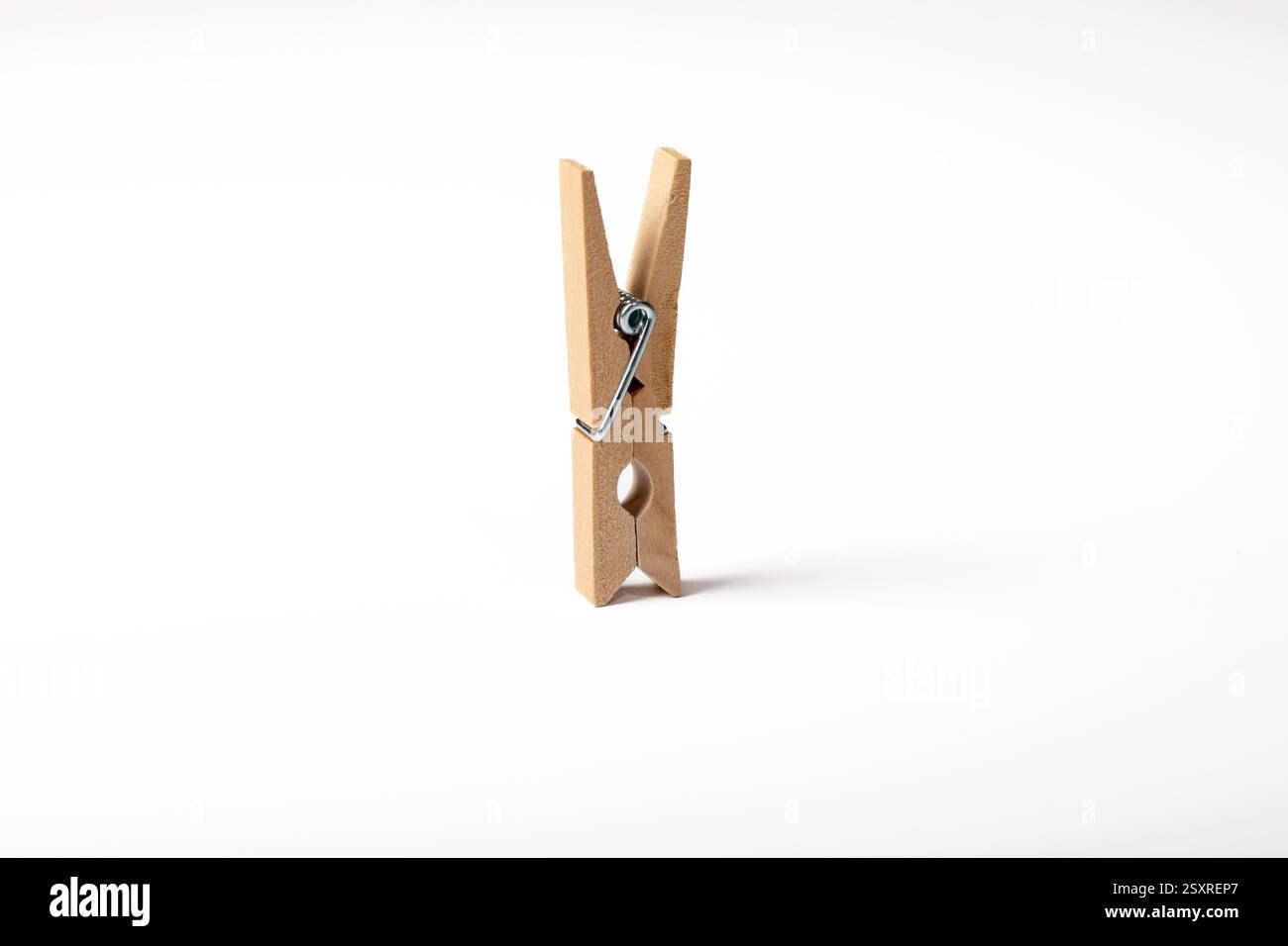 Wooden clothes peg isolated on white background Stock Photo - Alamy