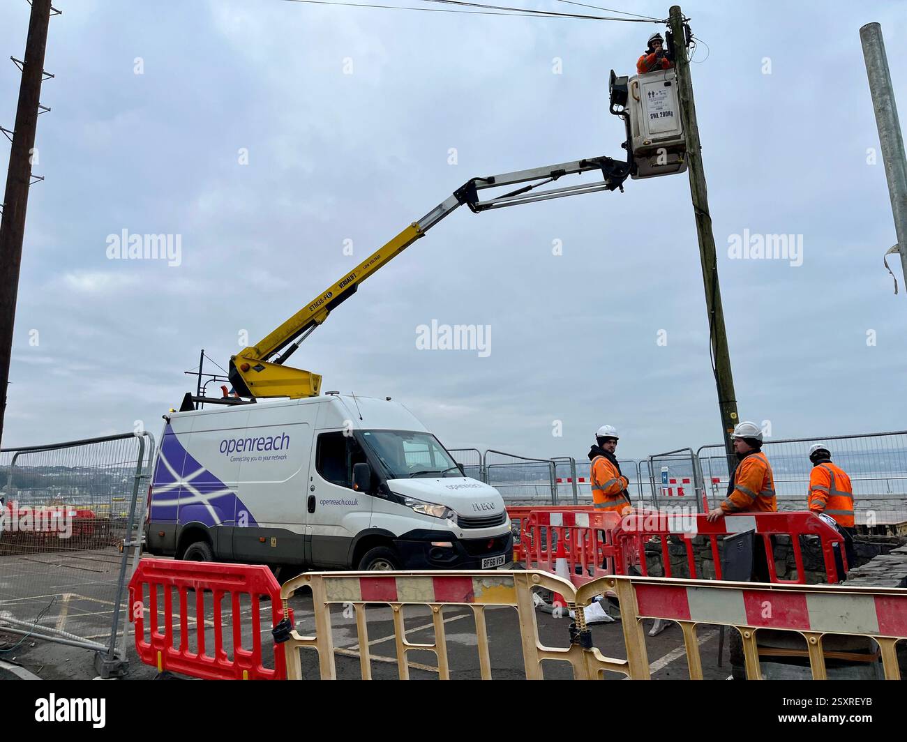 Openreach engineers working on a telephone wire from a Cherry Picker ...