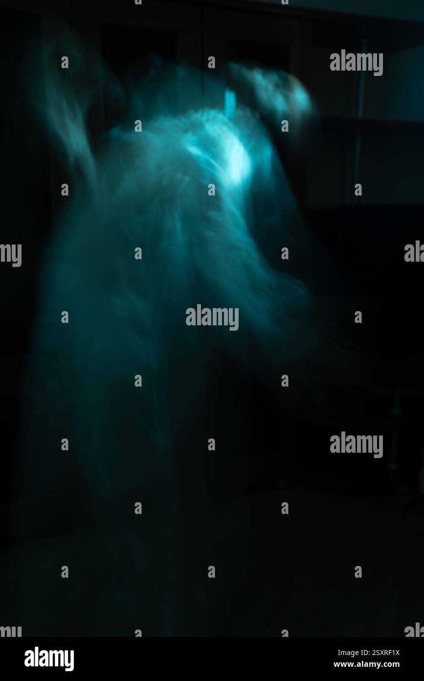 A ghostly, glowing figure with motion blur, creating a mysterious and ...