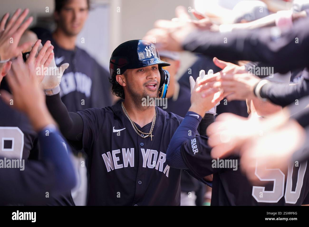 New York Yankees Everson Pereira is greeted in the dugout after his ...