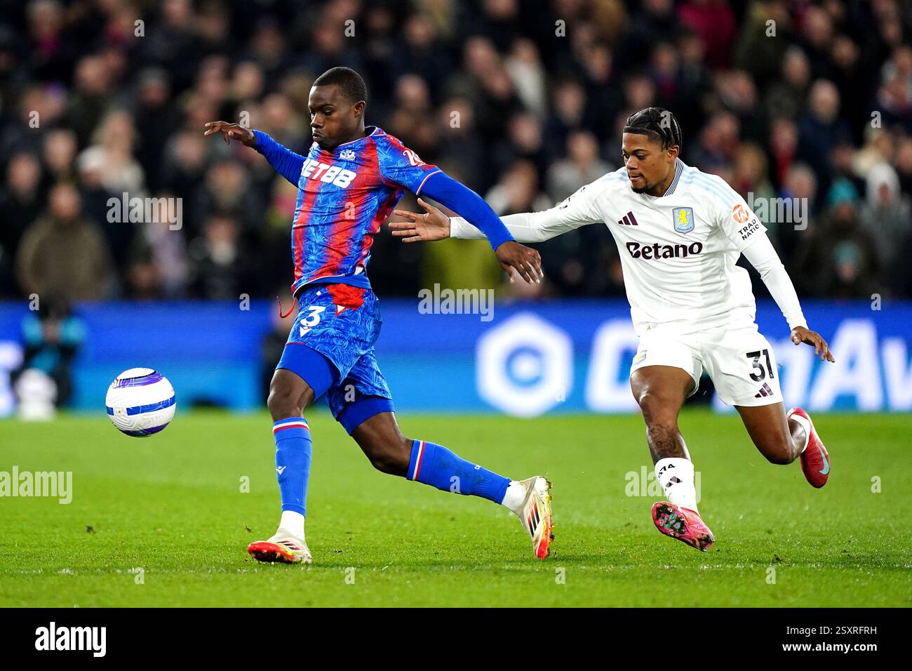 Crystal Palace's Tyrick Mitchell (left) and Aston Villa's Leon Bailey ...