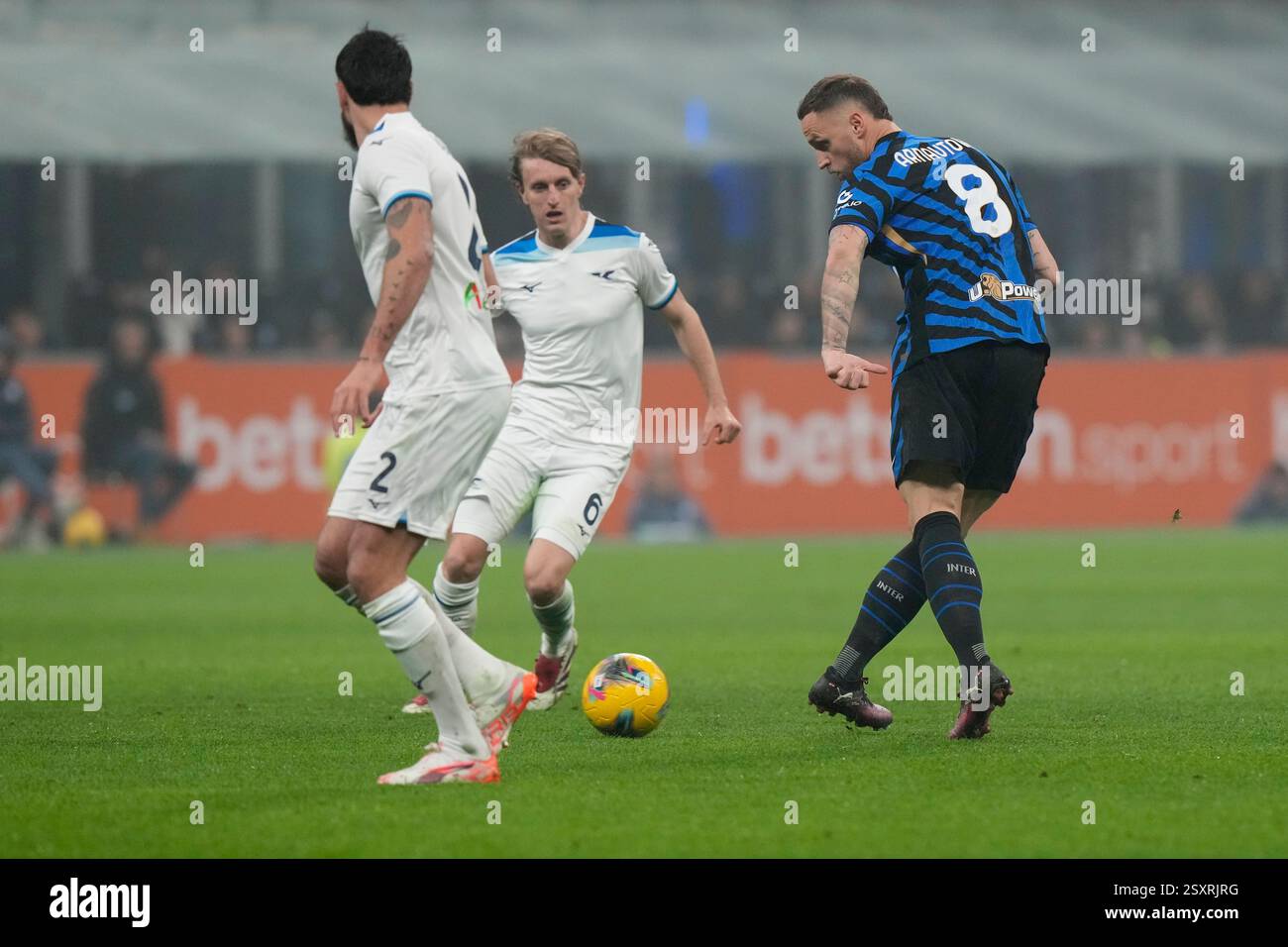 Inter Milan's Marko Arnautovic, right, controls the ball ahead of Lazio's Nicolo Rovella, centre ...