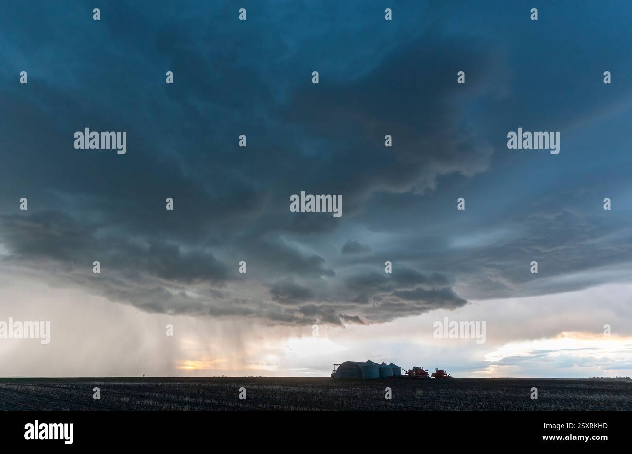Supercell thunderstorm brings heavy rain over a farm at sunset Stock ...