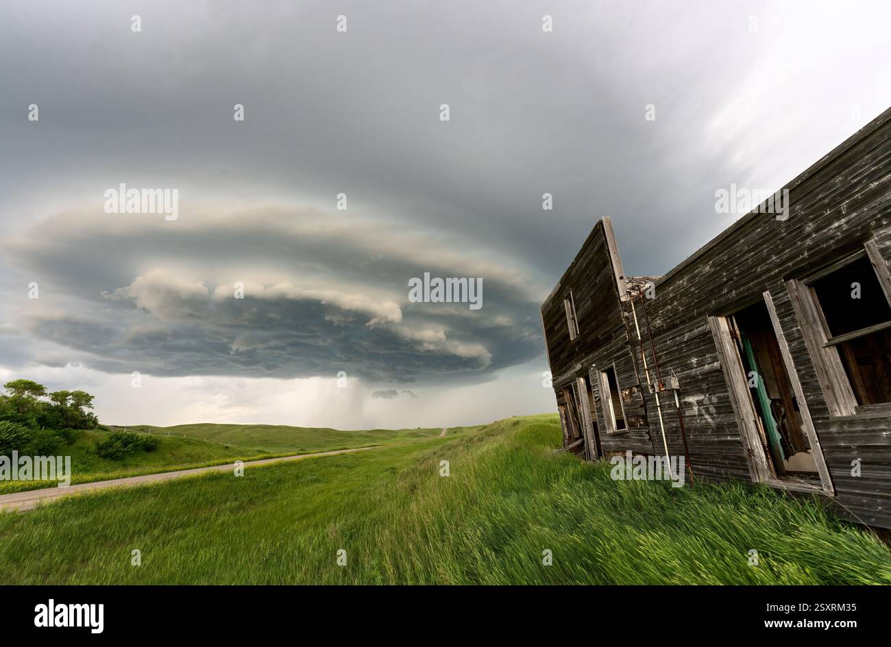 Dramatic supercell thunderstorm developing over an abandoned wooden ...