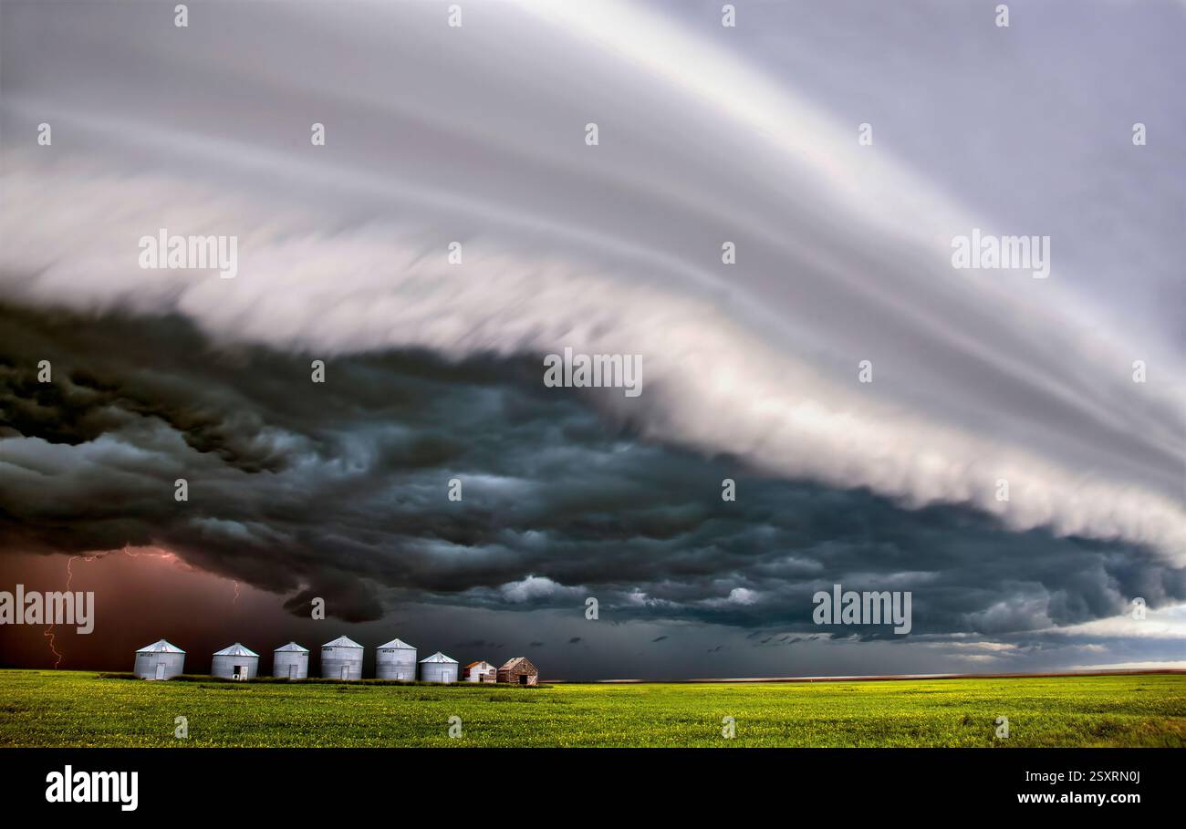 Dramatic supercell thunderstorm shelf cloud forming over a farm with ...