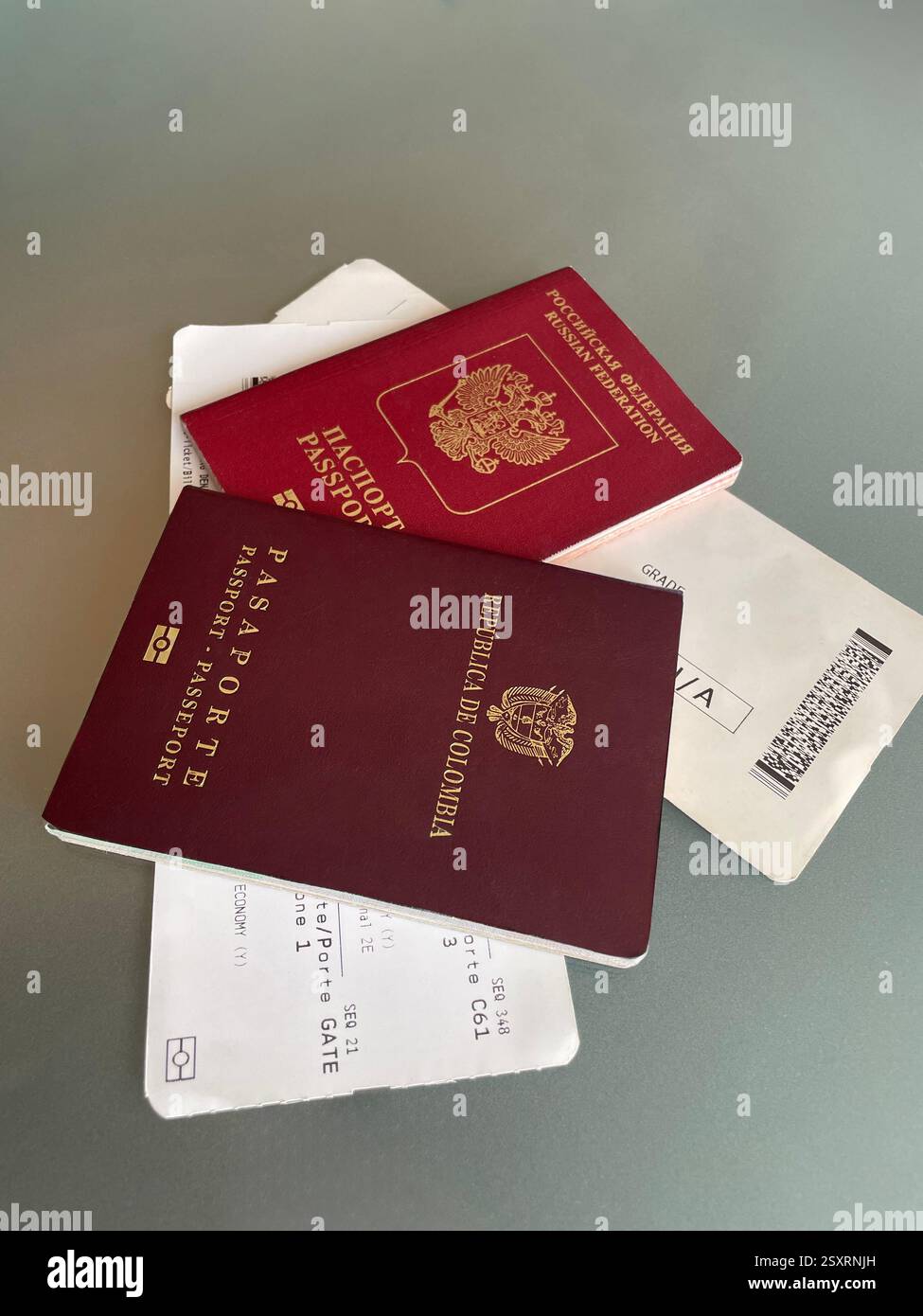 Russian and Colombian biometric passports with a couple of tickets ...