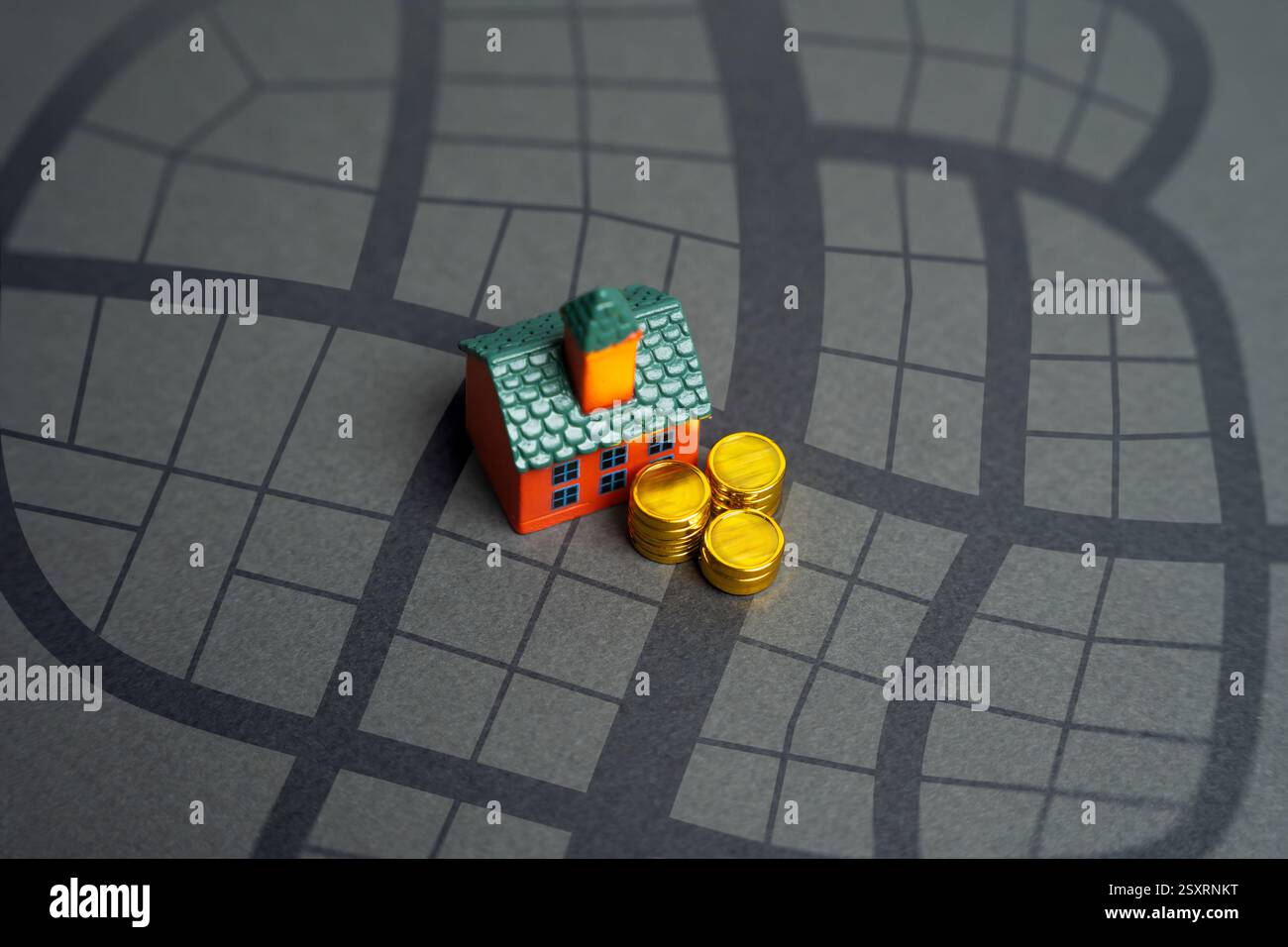 House figure with coins on the city map. Government institutions and ...