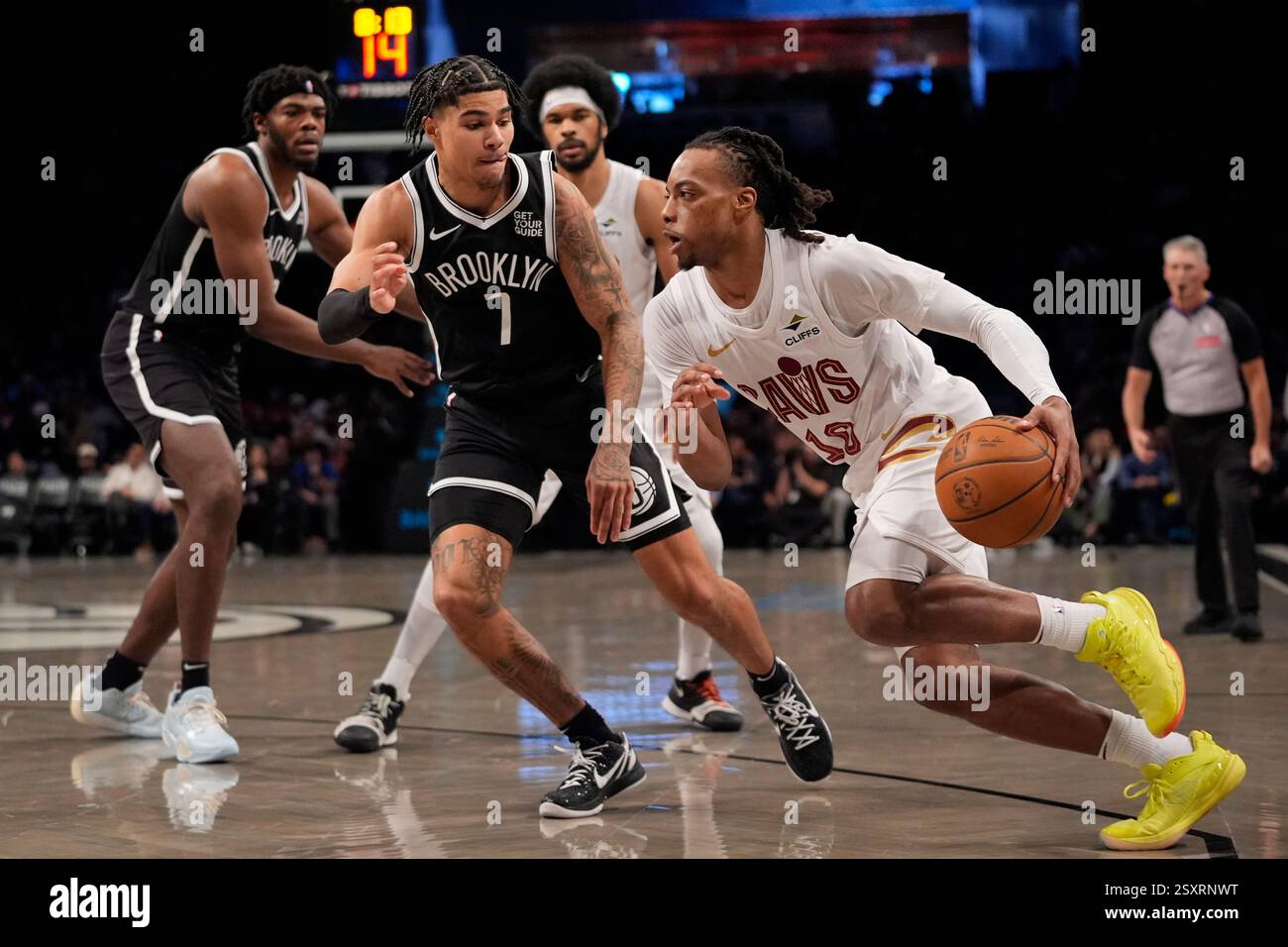 Cleveland Cavaliers' Darius Garland (10) drives past Brooklyn Nets' Day ...