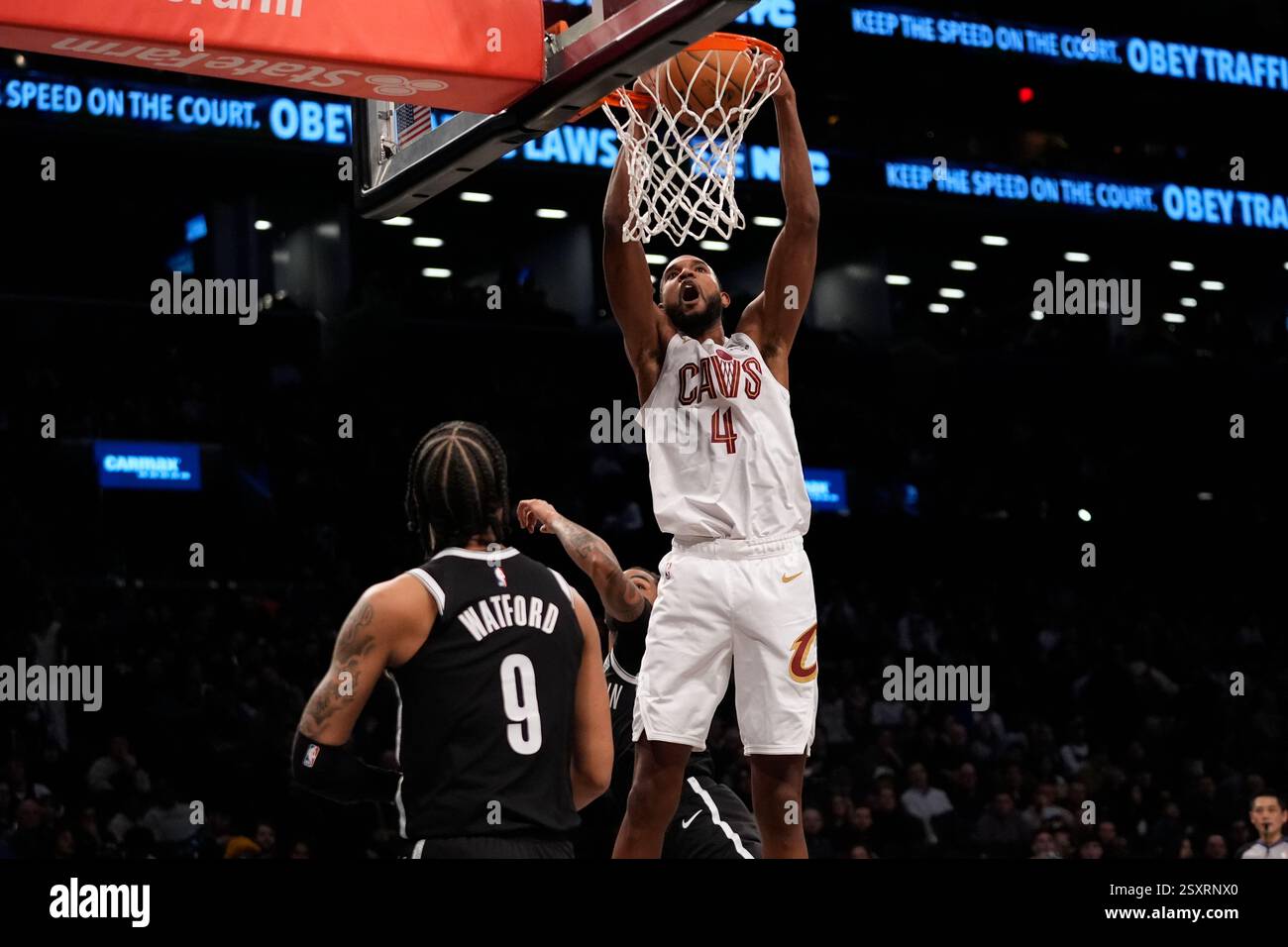 Cleveland Cavaliers' Evan Mobley (4) dunks the ball in front of ...