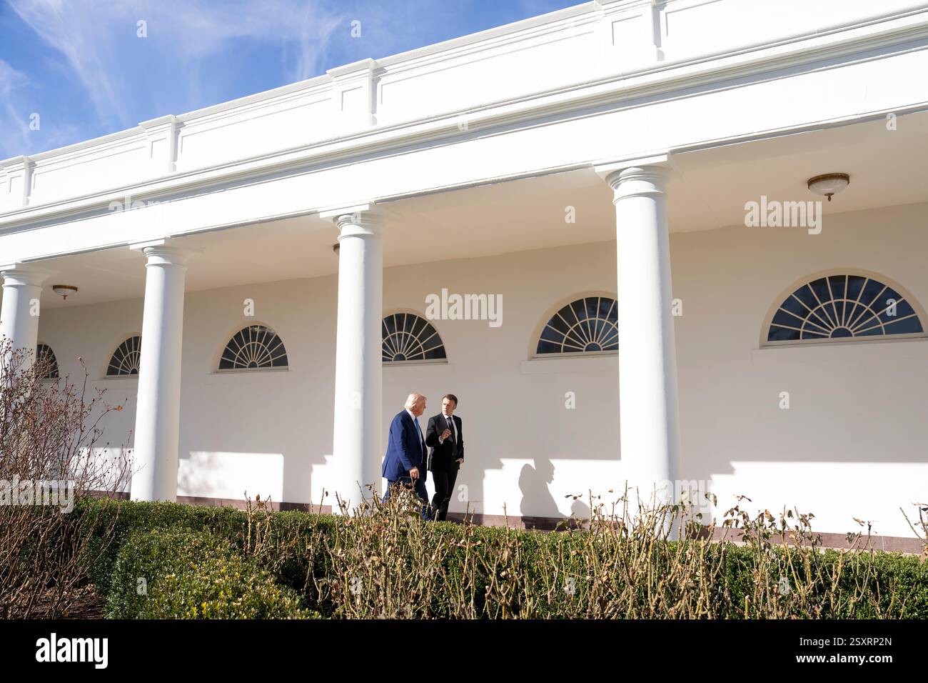 President Donald Trump walks along the West Colonnade with French ...
