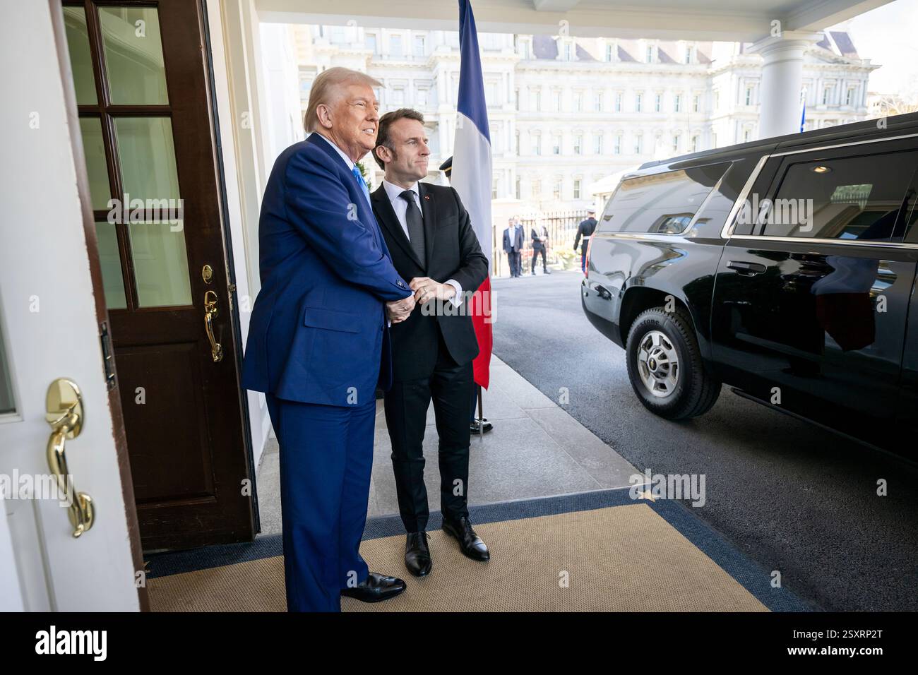 President Donald Trump greets French President Emmanuel Macron, Monday ...