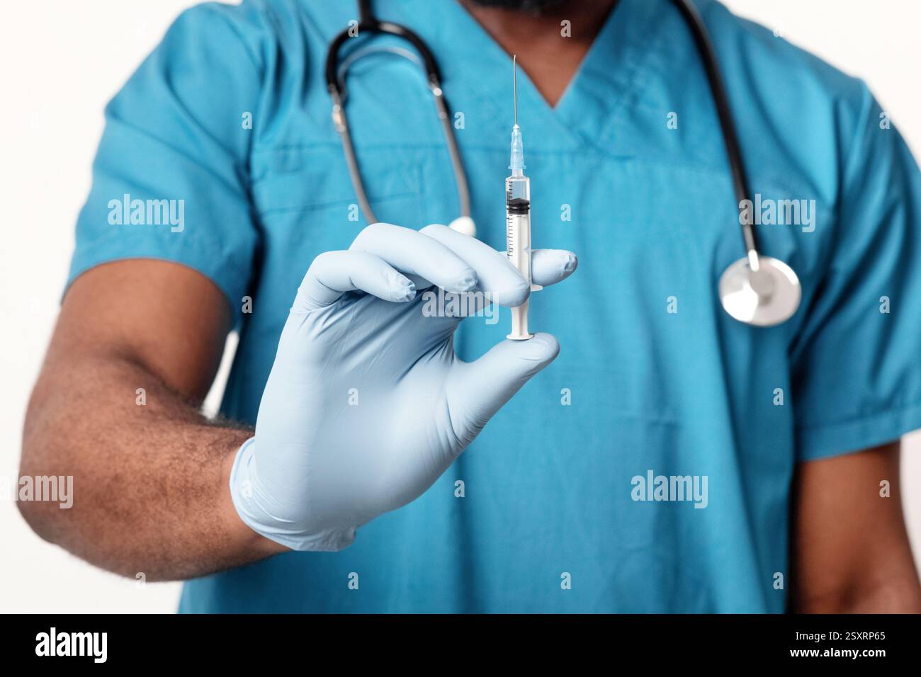 Healthcare professional holds syringe ready for medical procedure Stock ...
