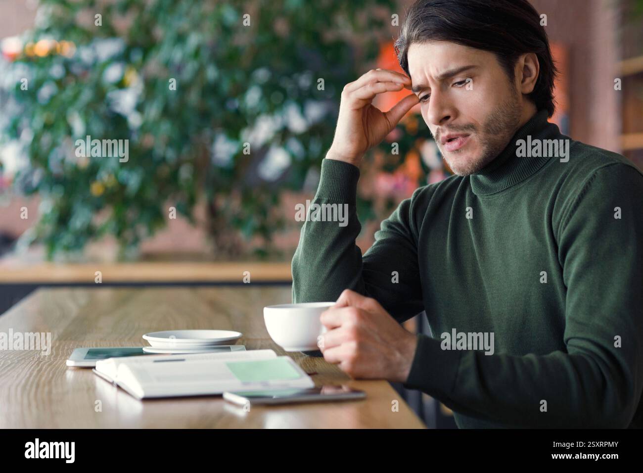 Depressed man having problems with job, drinking coffee at cafe Stock ...