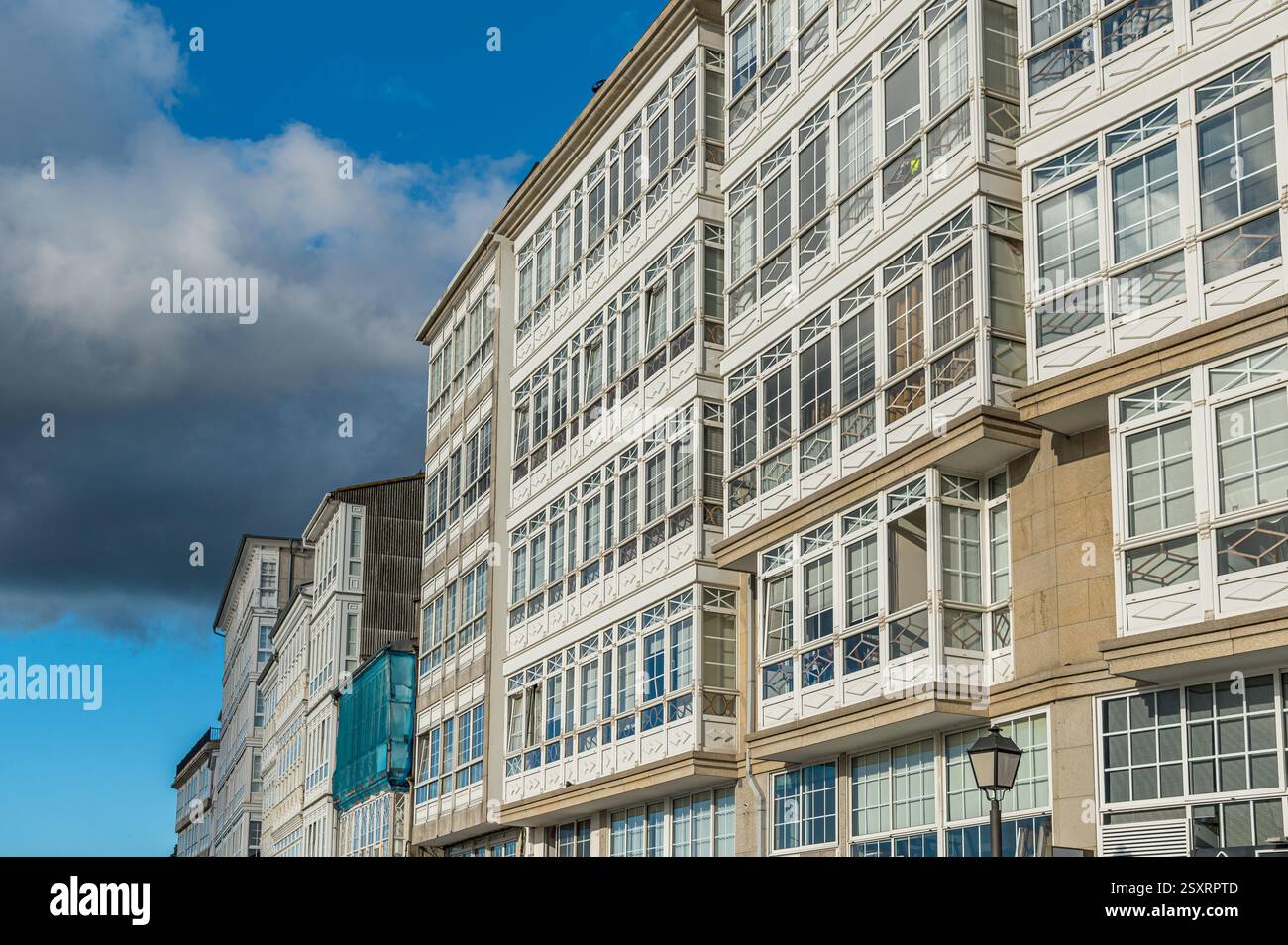 Glass facade of traditional old buildings in the town of Viveiro, Lugo ...