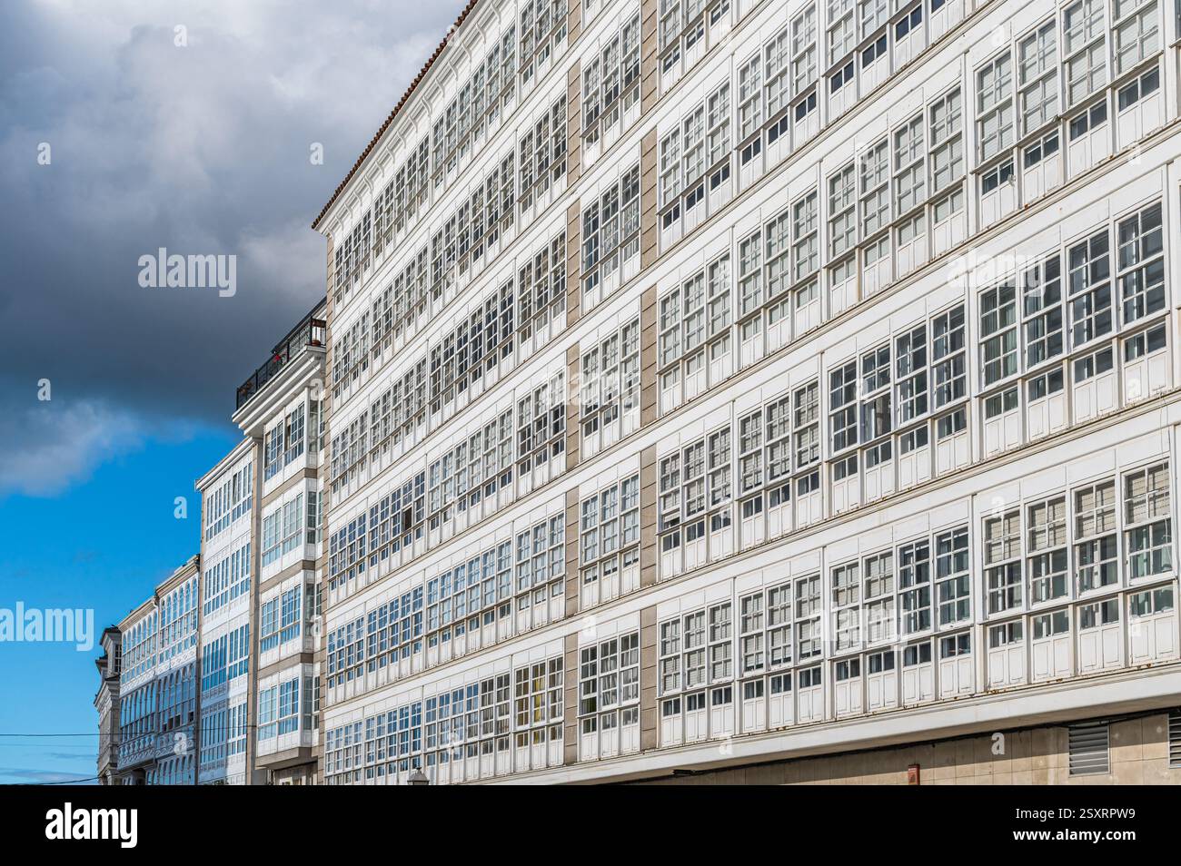 Glass facade of traditional old buildings in the town of Viveiro, Lugo ...