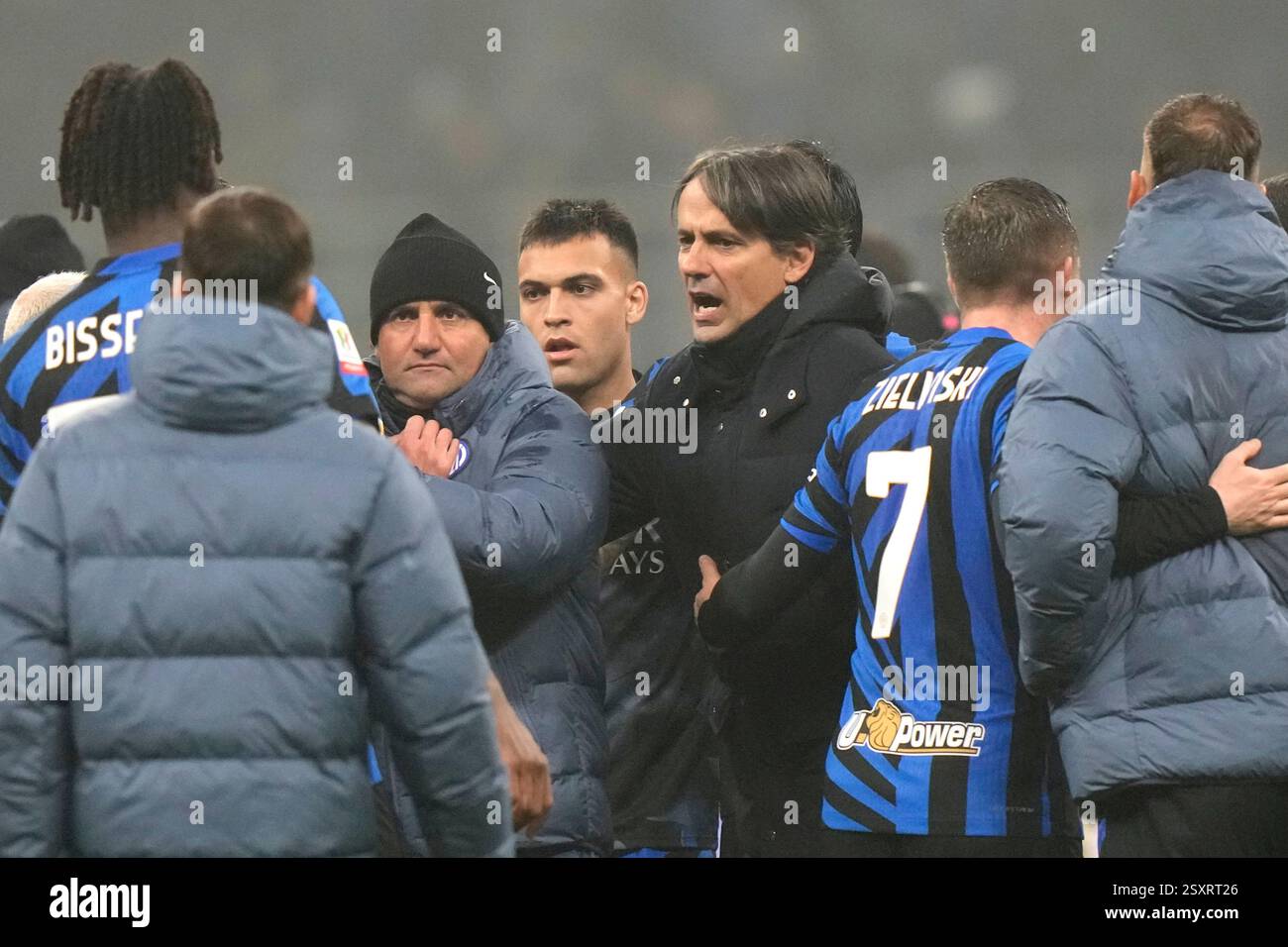 Inter Milan's head coach Simone Inzaghi, centre, greets his players at ...