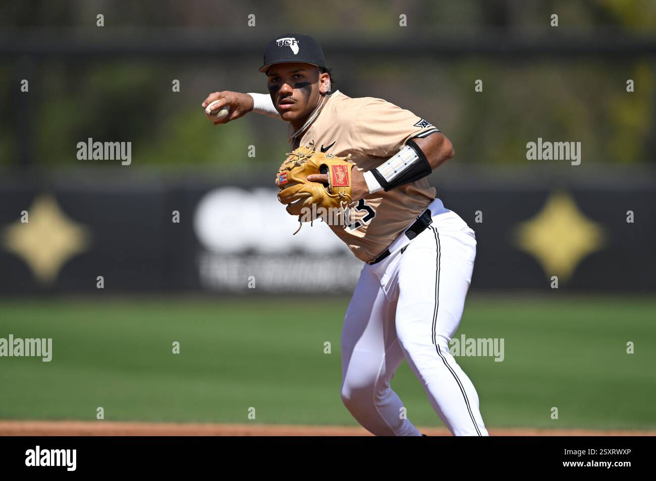 Central Florida infielder Edian Espinal (23) throws during an NCAA ...