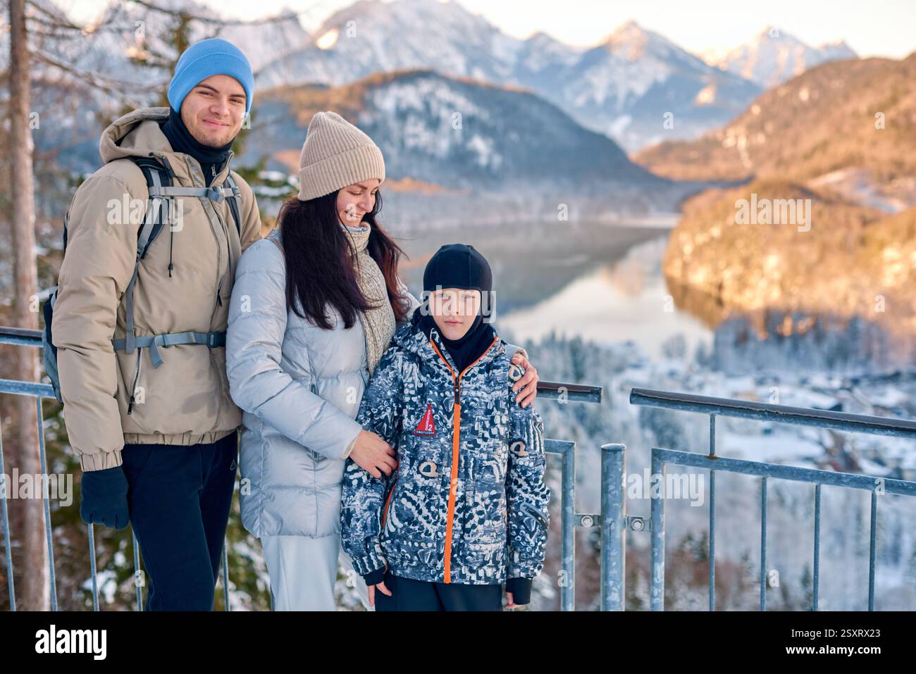 Adventurous Family Enjoying Mountain Sunset Panorama at Scenic Winter ...