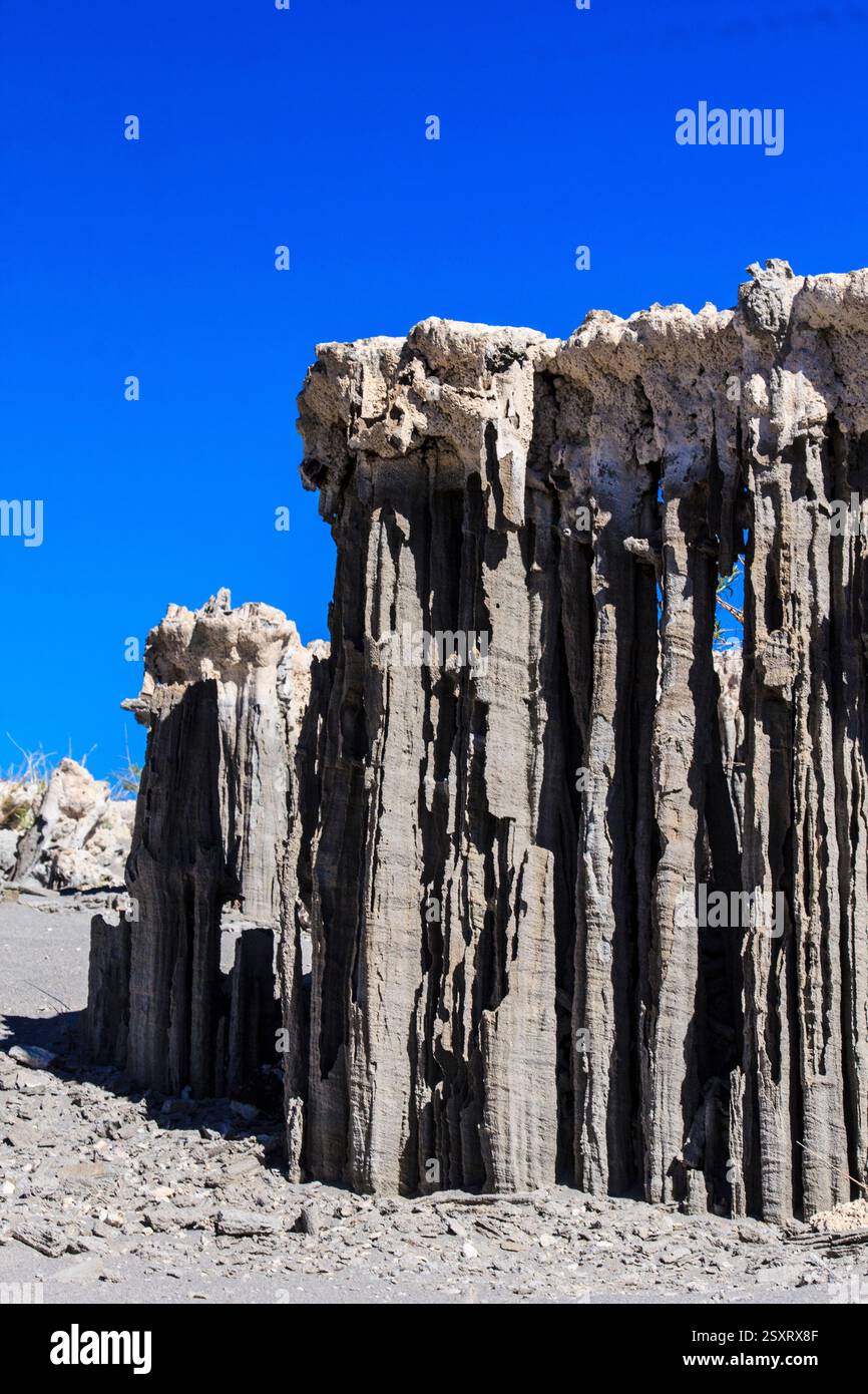 Large rock formation with a blue sky in the background. The rocks are ...