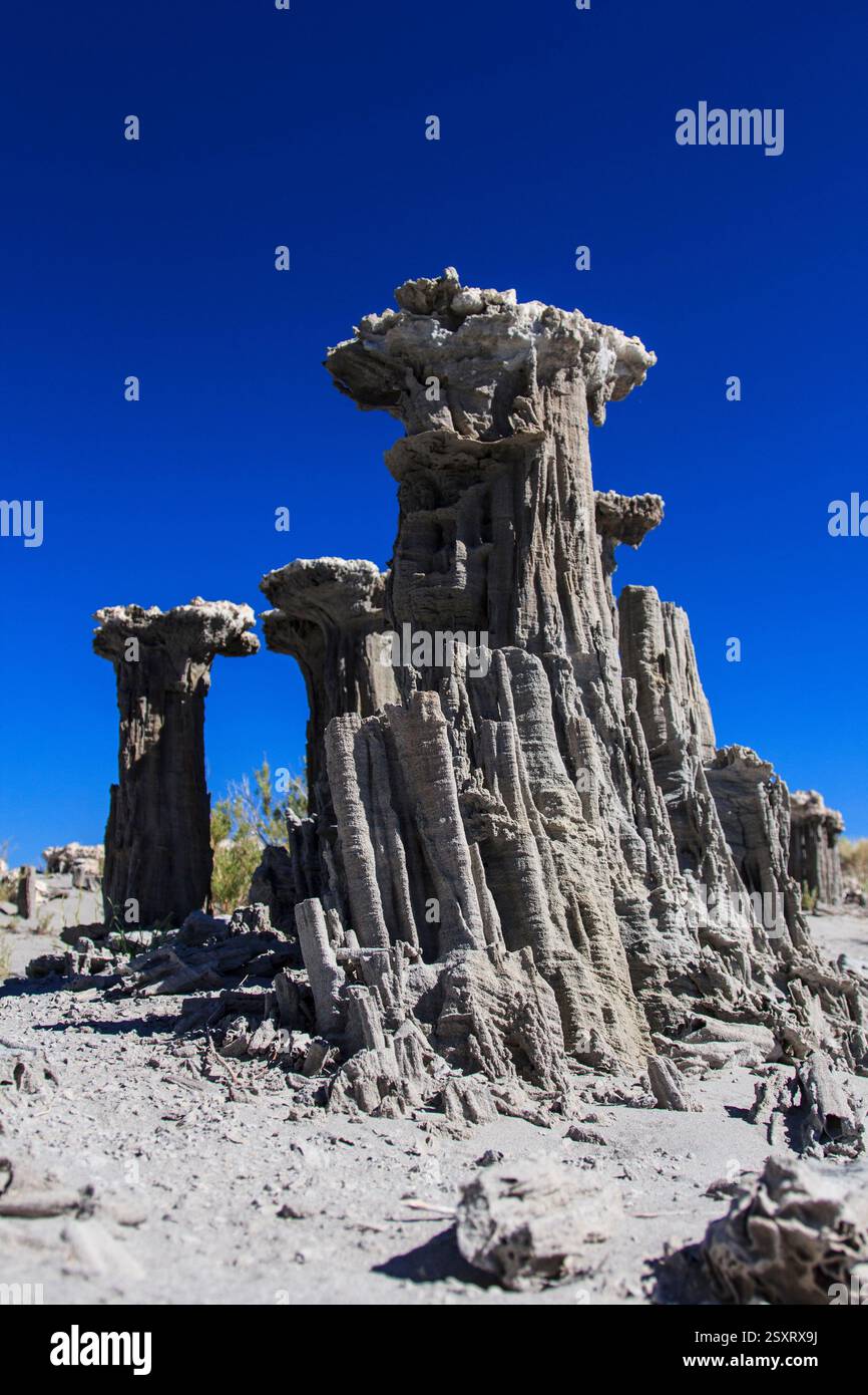 Large rock formation with three tall pillars. The pillars are grey and ...