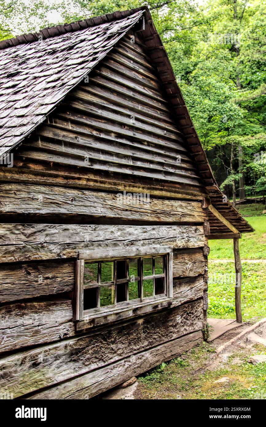 Small house with a slanted roof. The roof is made of wood. The house ...