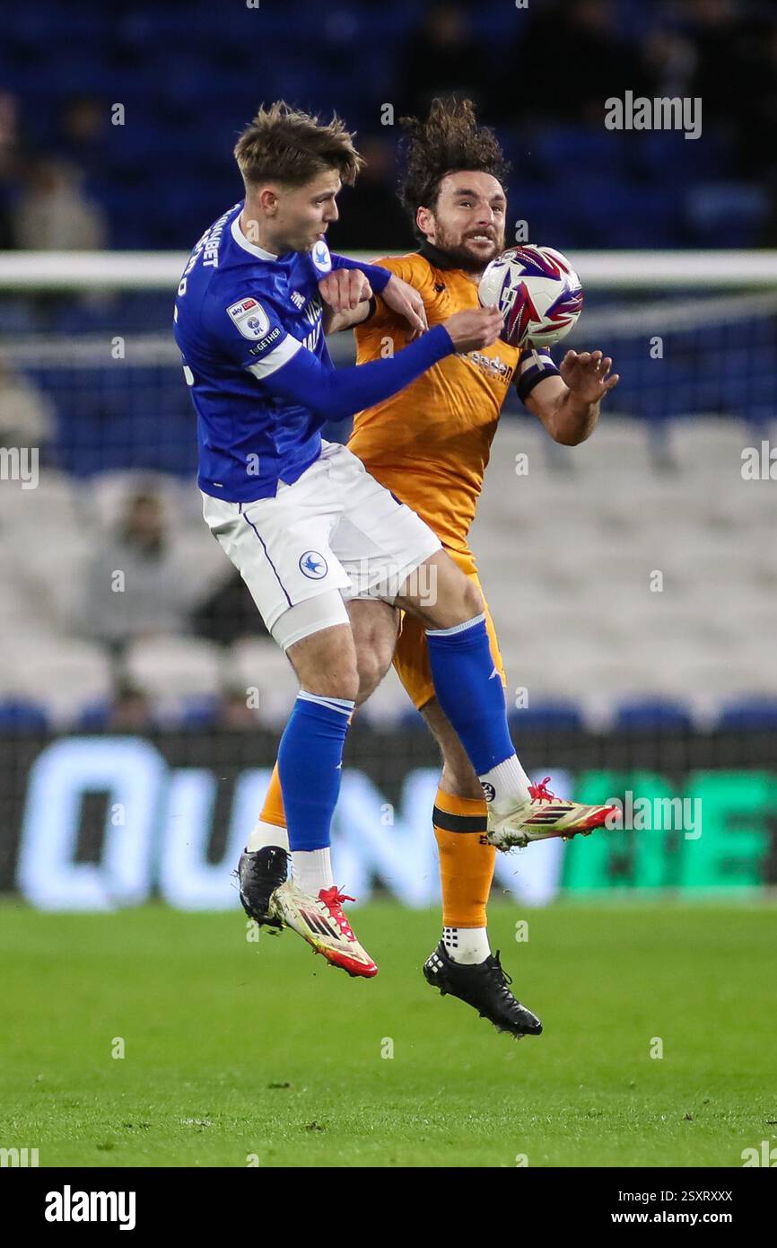Cardiff, UK. 25th Feb, 2025. Cian Ashford of Cardiff City and Lewis ...