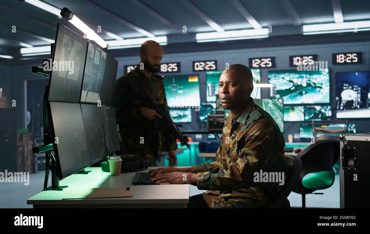 Intelligence operative in military base doing surveillance with digital ...