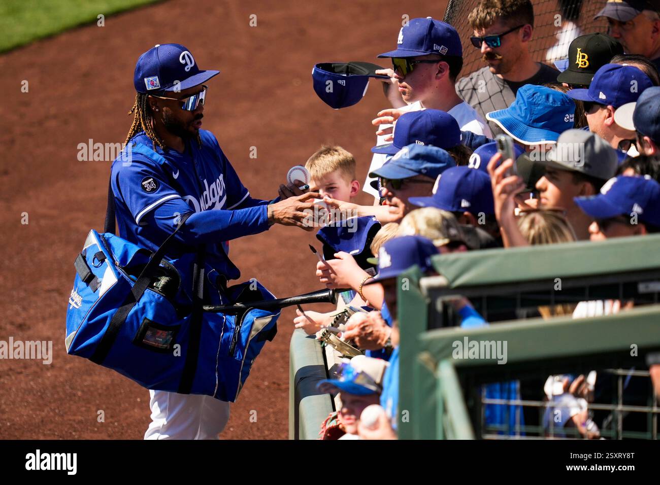 Los Angeles Dodgers outfielder Justin Dean signs autographs for fans ...