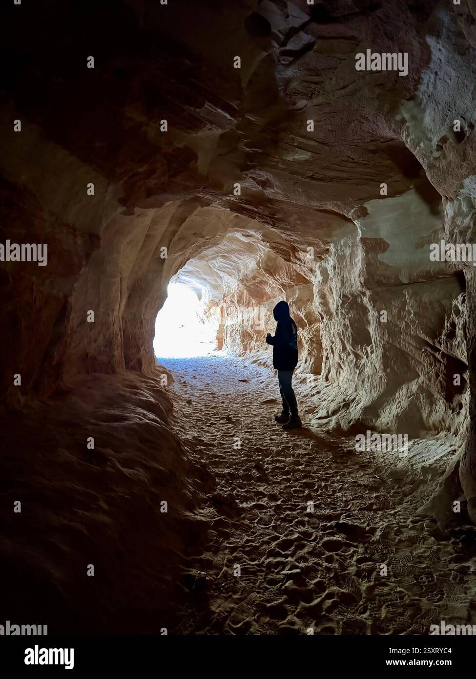 Man in Cave Stock Photo - Alamy