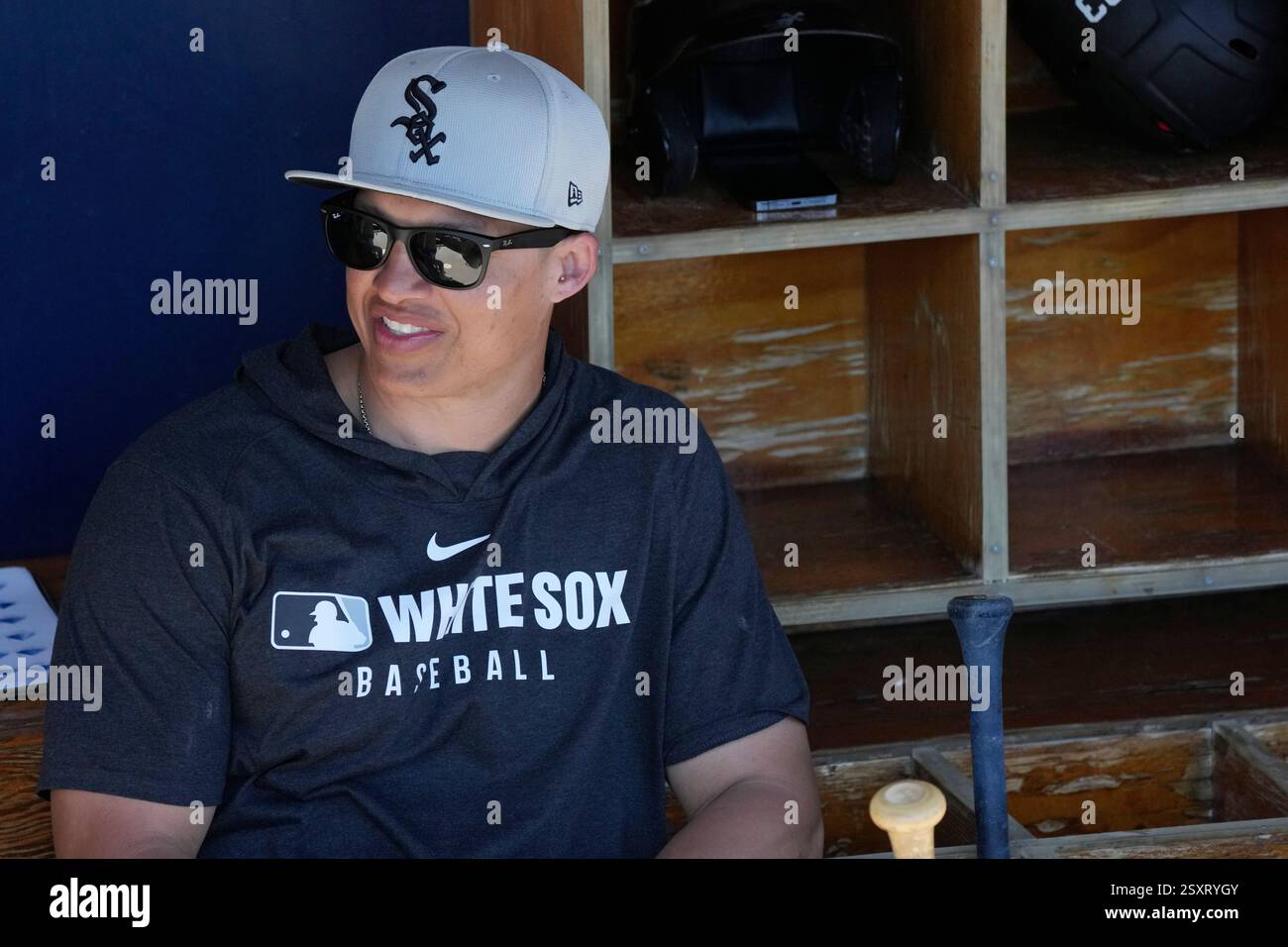 Chicago White Sox manager Will Venable smiles as he sits in the dugout ...