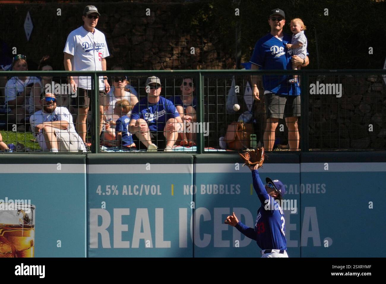 Los Angeles Dodgers center fielder James Outman catches a fly ball hit ...