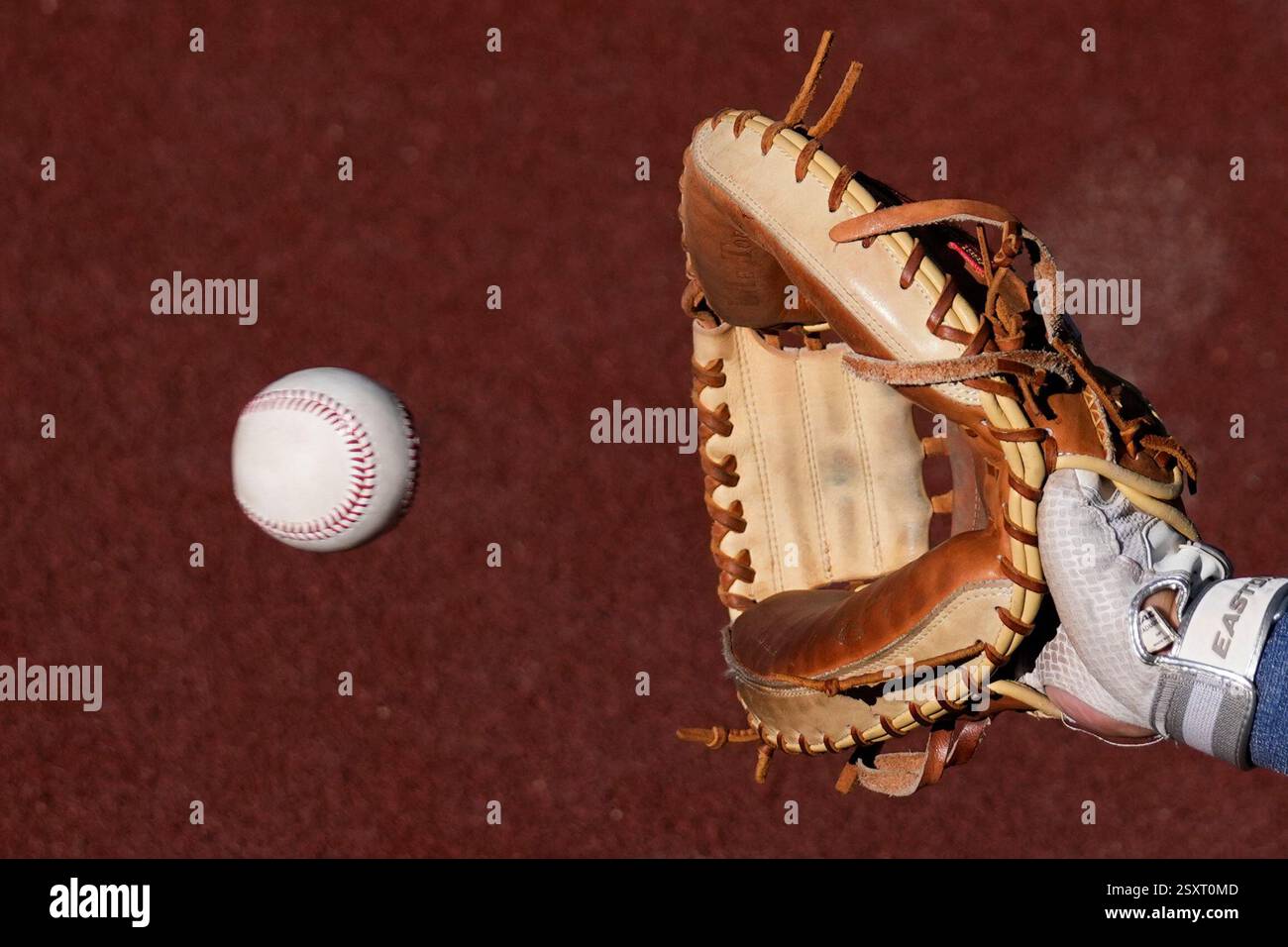 Seattle Mariners catcher Connor Charming warms up in the bullpen before ...