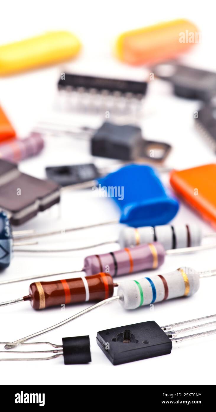 A collection of assorted electronic components, including resistors and capacitors, is arranged ...