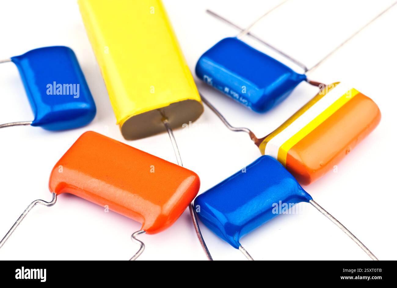 Collection of various capacitors in bright colors arranged on a white surface Stock Photo - Alamy